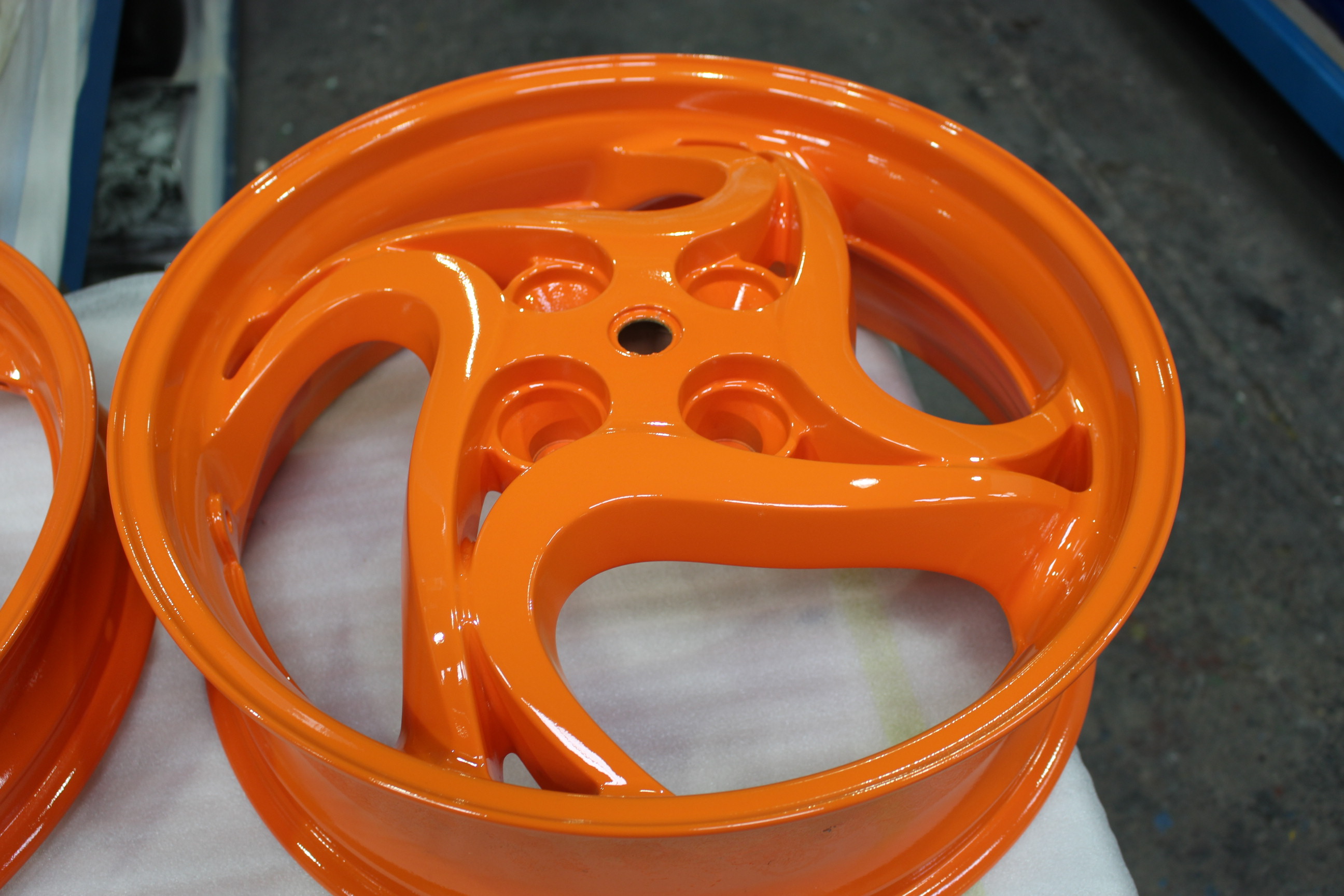 Motorbike alloy wheels painted orange